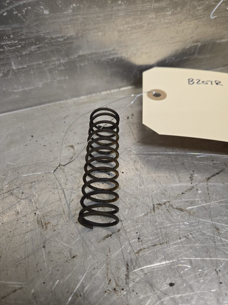 B207R B TAPPET SHAFT SPRING / STARTER SPRING | B207R - Shumaker Tractor